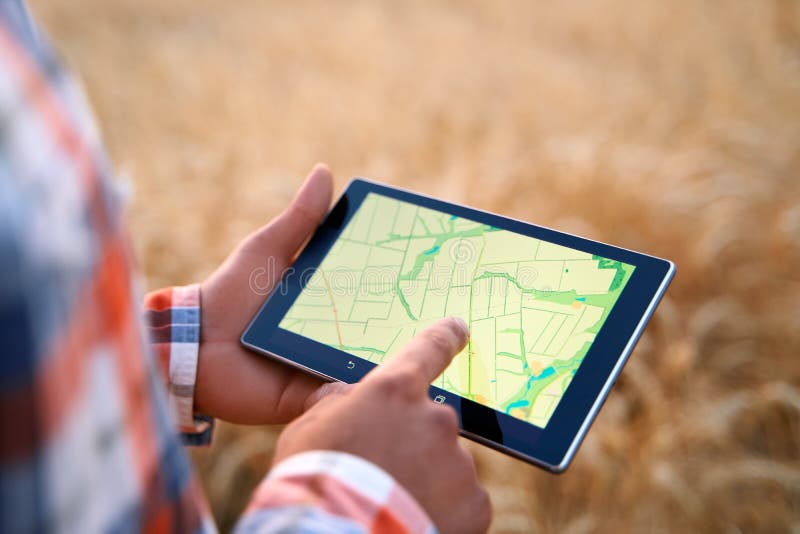 Precision Farming. Farmer Holding Tablet for Combine Harvester Guidance ...