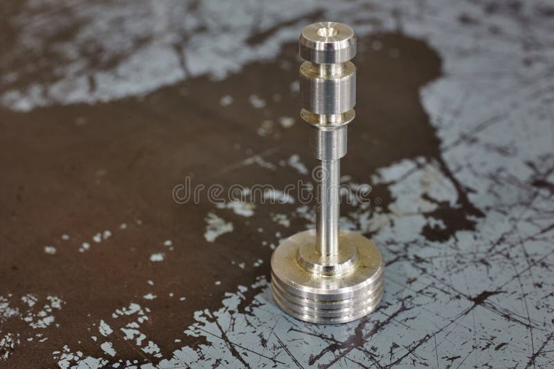 Precision Machined Component on Weathered Industrial Surface Stock ...