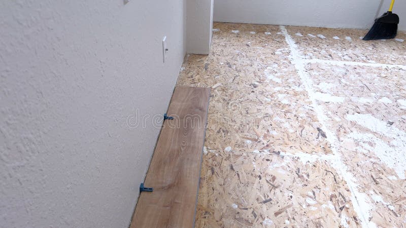 Precision in Progress: Installing a Vinyl Floorboard Stock Photo ...