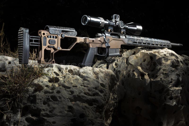 Precision Rifle on Rocks with Black Behind Stock Photo - Image of dark ...
