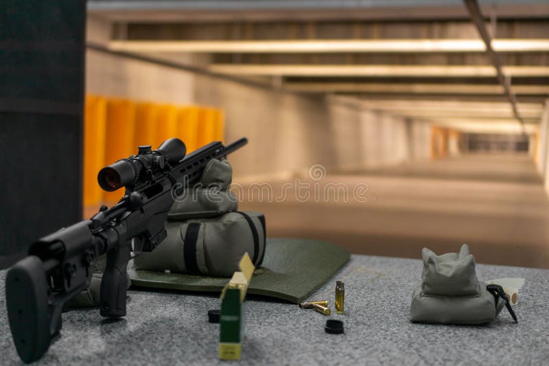 Precision Sniper Rifle on Shooting Range Mat with Ammunition Stock ...