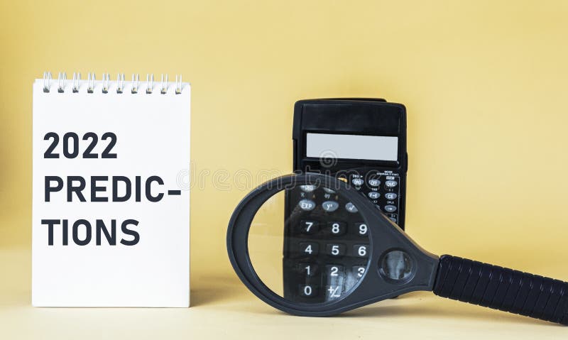 2022 Predictions , Text on Notebook with Calculator and Magnifying ...