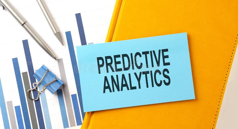 PREDICTIVE ANALYTICS Text on Sticker on the Yellow Notebook with Chart ...