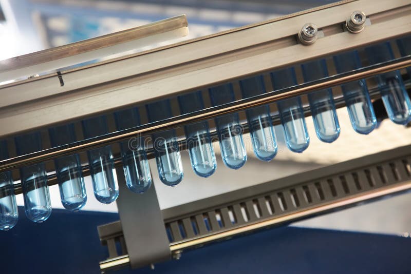 Conveyor with preform stock image. Image of conveyor - 157568185