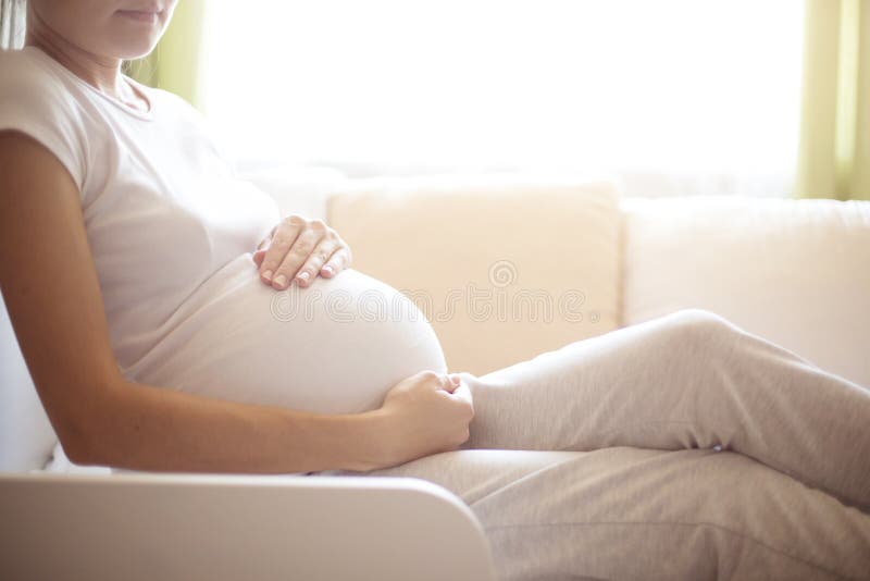 Pregnancy Happy Pregnant Woman Lying In Bed And Touching Her Belly At