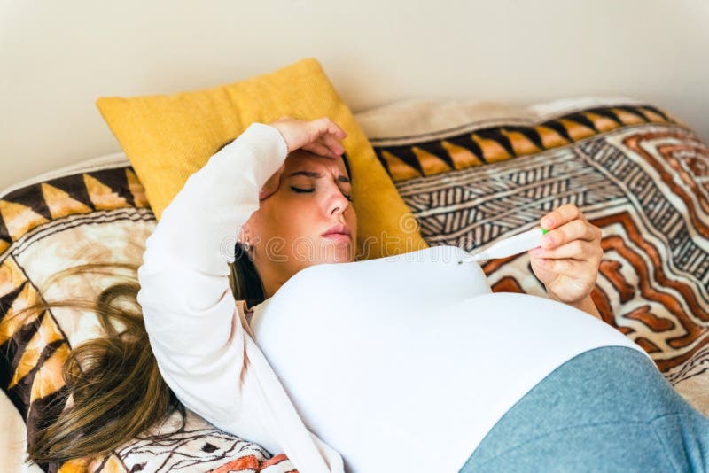 Pregnancy Health Temperature Check. Pregnant Woman Holding Thermometer ... Pregnancy Health Temperature Check. Pregnant Woman Holding Thermometer ...