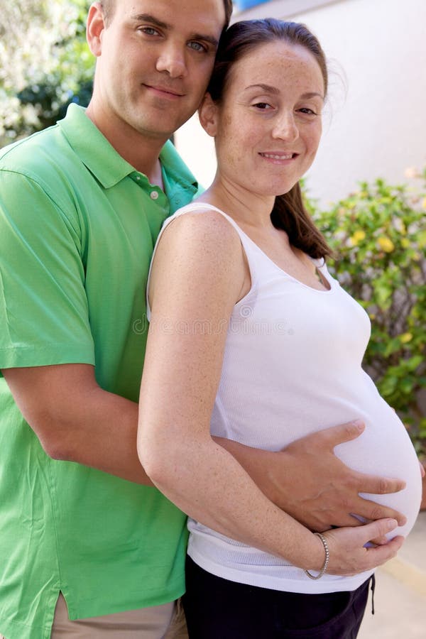 Young Pregnant Couple in Love Stock Photo - Image of blue, plus: 13253864
