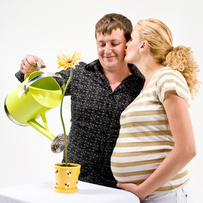Expecting Couple Watering Flower Stock Photos - Free & Royalty-Free ... Expecting Couple Watering Flower Stock Photos - Free & Royalty-Free ...