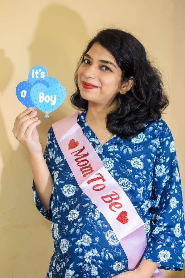 A Pregnant Indian Lady Poses For Indoor Pregnancy Shoot And Hands On Belly Indian Pregnant
