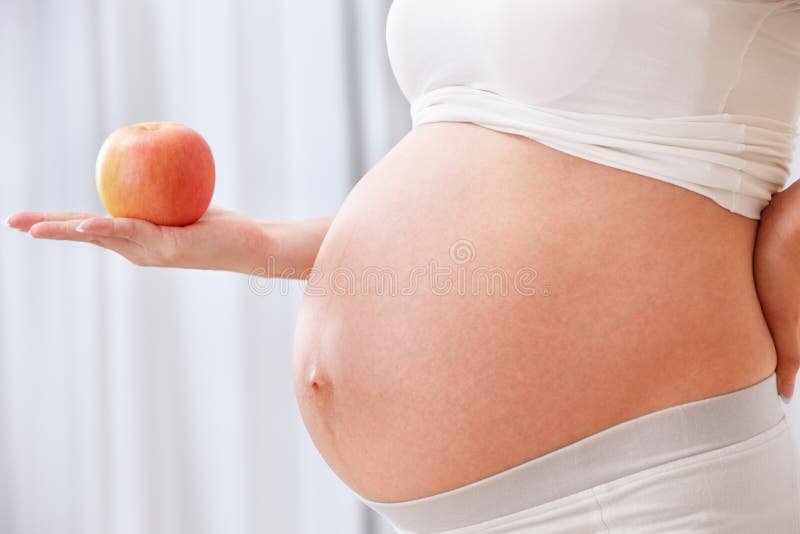 Pregnant Lady Holding Apple Stock Photo - Image of womb, people: 17066528