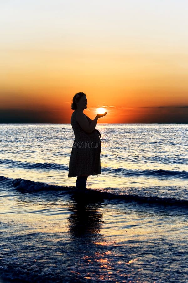 Pregnant woman at sunset stock photo. Image of beauty - 27857028