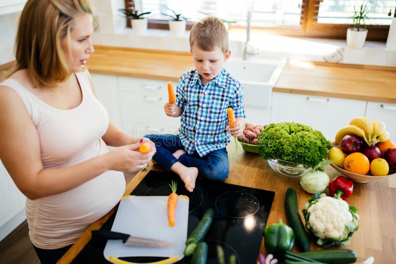 Pregnant Mom and Child Preparing Meal Stock Photo - Image of nutrition ...