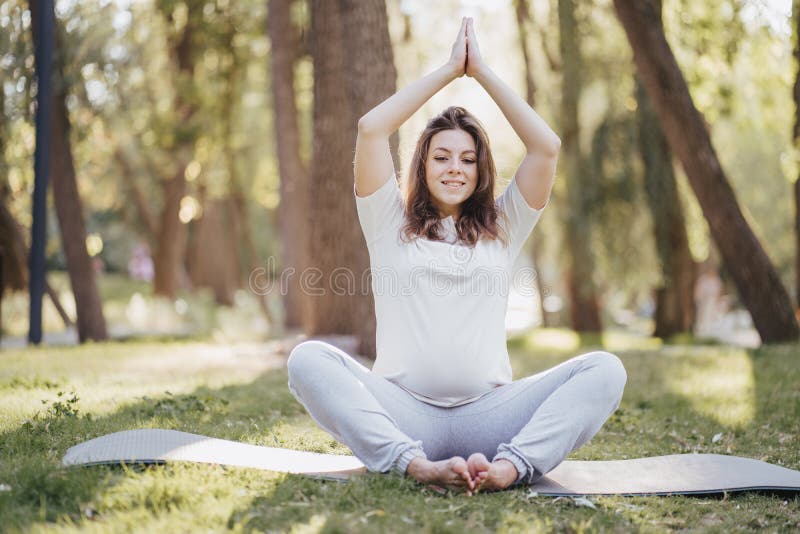 Pregnant Woman Doing Yoga Exercises Outdoors Stock Image Image Of