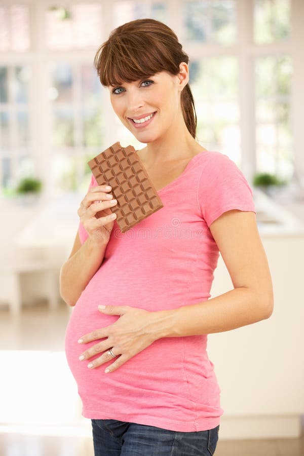 Pregnant Woman Eating Chocolate Stock Images Image 25390544
