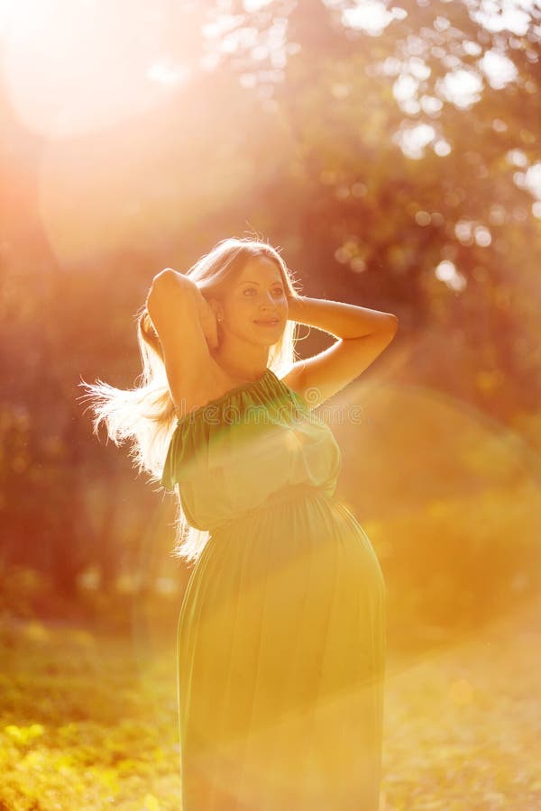 Pregnant Woman in the Glow of Evening Light Stock Image - Image of ...