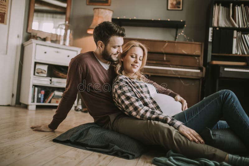 Pregnant Woman With A Husband Sitting On The Floor Stock Image Image