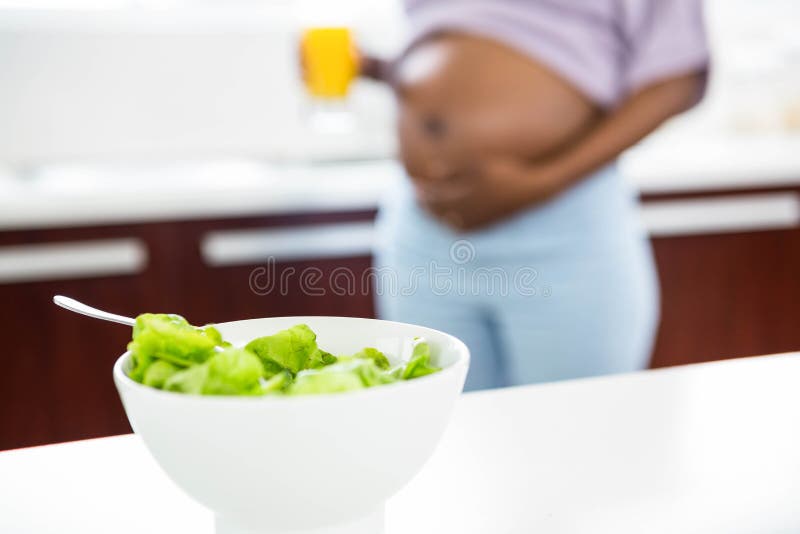 Pregnant Woman in Kitchen with Salad on Table Stock Photo - Image of ...