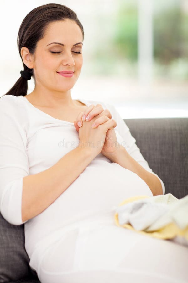 Pregnant woman praying stock image. Image of adult, home - 33680347