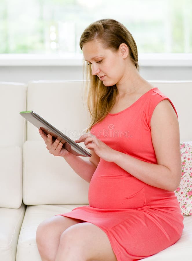 Pregnant Woman Using Electronic Tablet Stock Photo - Image of ...