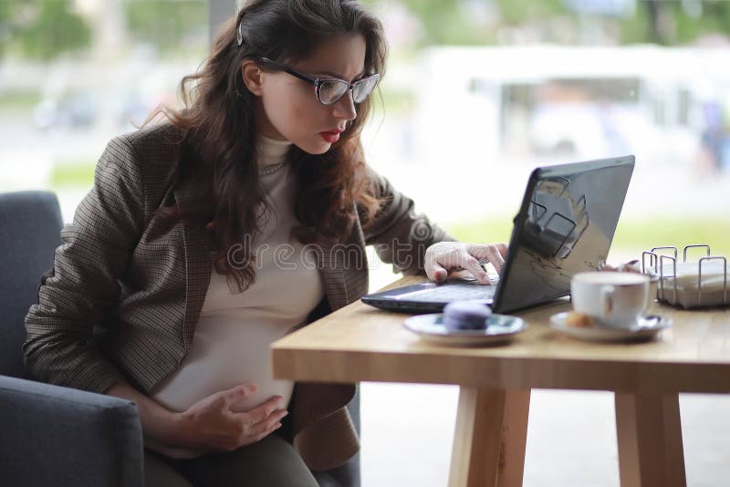 Pregnant Woman Working on Computer in Cafe Stock Photo - Image of ...