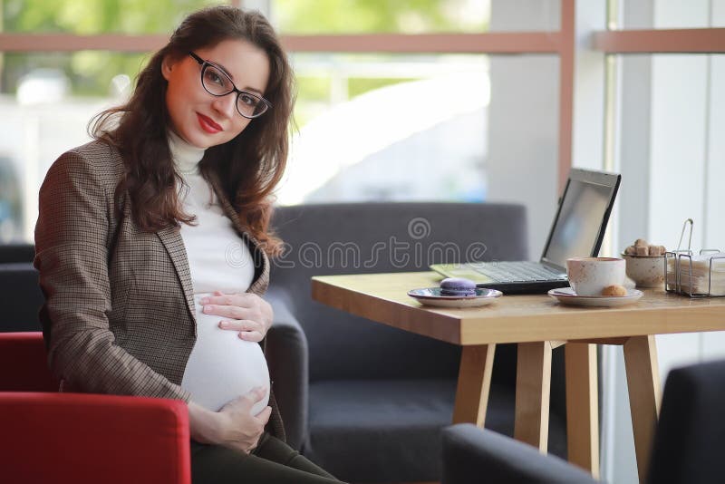 Pregnant Woman Working on Computer in Cafe Stock Image - Image of ...