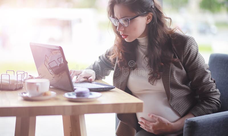 Pregnant Woman Working on Computer in Cafe Stock Photo - Image of ...
