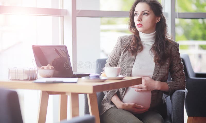 Pregnant Woman Working on Computer in Cafe Stock Image - Image of ...