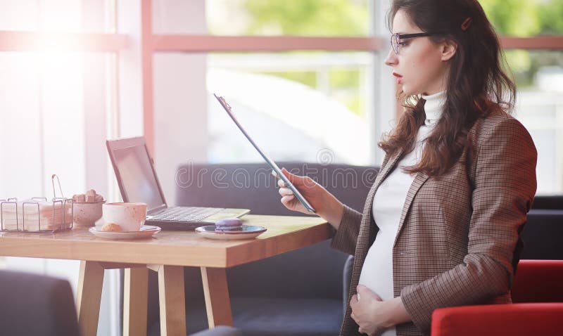 Pregnant Woman Working on Computer in Cafe Stock Image - Image of ...