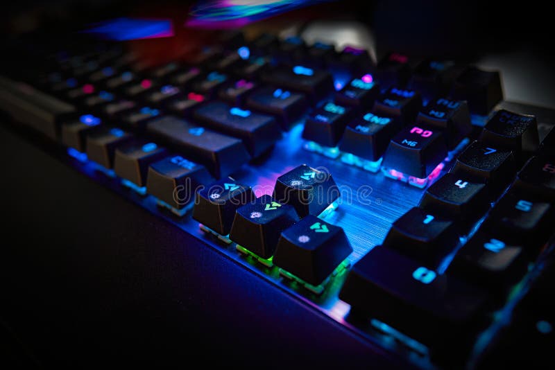 Premium Gaming RGB LED Backlit Keyboard. Mostly Purple and Blue. Side ...