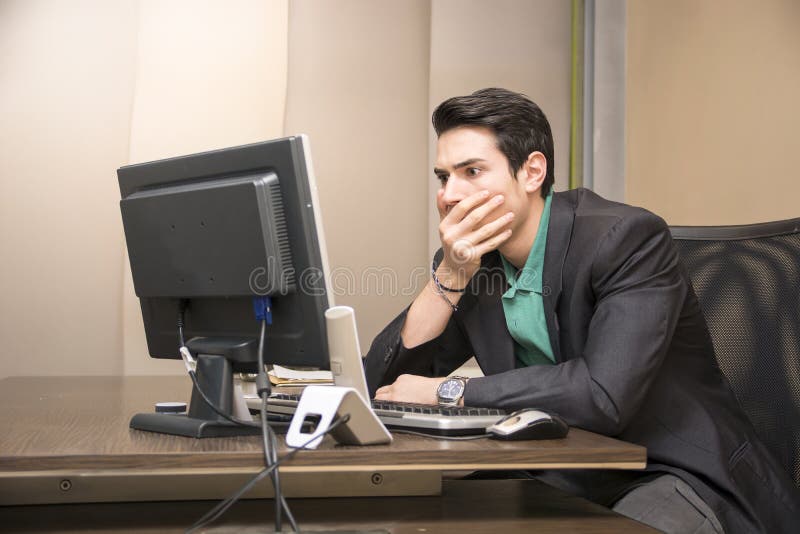 Preoccupied, Worried Young Man Staring at Computer Stock Image - Image ... Preoccupied, Worried Young Man Staring at Computer Stock Image - Image ...