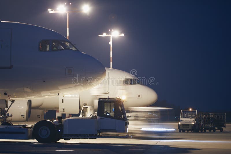 Preparation of Airplanes at Airport Stock Photo - Image of dark, work ...