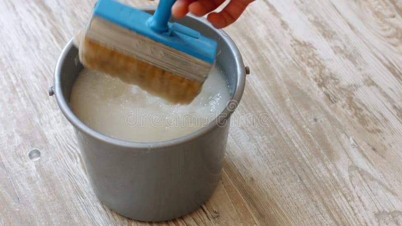 Preparation of Construction Glue in a Bucket. Stock Video - Video of ...