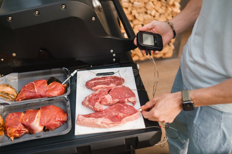 Preparation for Cooking Meat on an Open Grill with Temperature Check ...