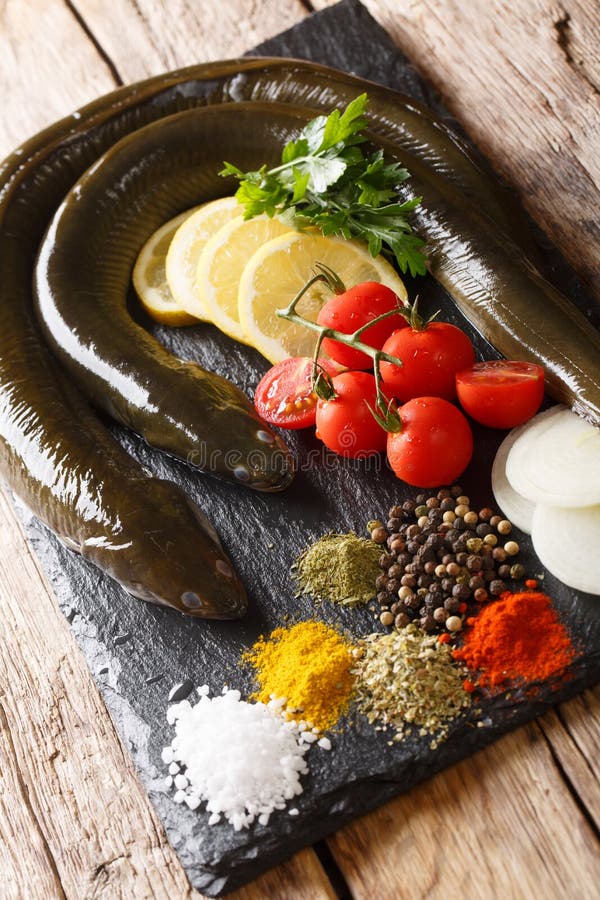 Preparation for Cooking Raw Eel with Spices, Vegetables and Lemon Close ...