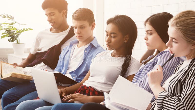 Preparation for Exams. Multiethnic Students with Laptop and Books Stock ...
