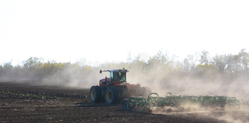 Preparation of the Field by a Farmer Using a Tractor Equipped with ...
