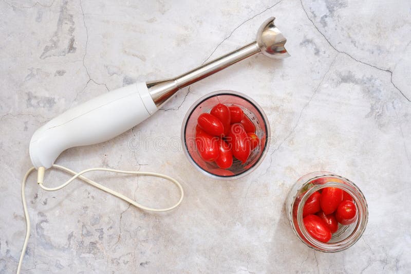 Preparation of Fresh Cherry Tomatoes for a Culinary Dish Using a Hand ...