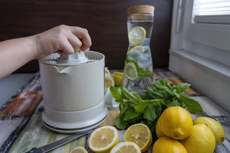 Preparation of Fresh Juices Press on Fresh Lemon and Lime. Lemon ...