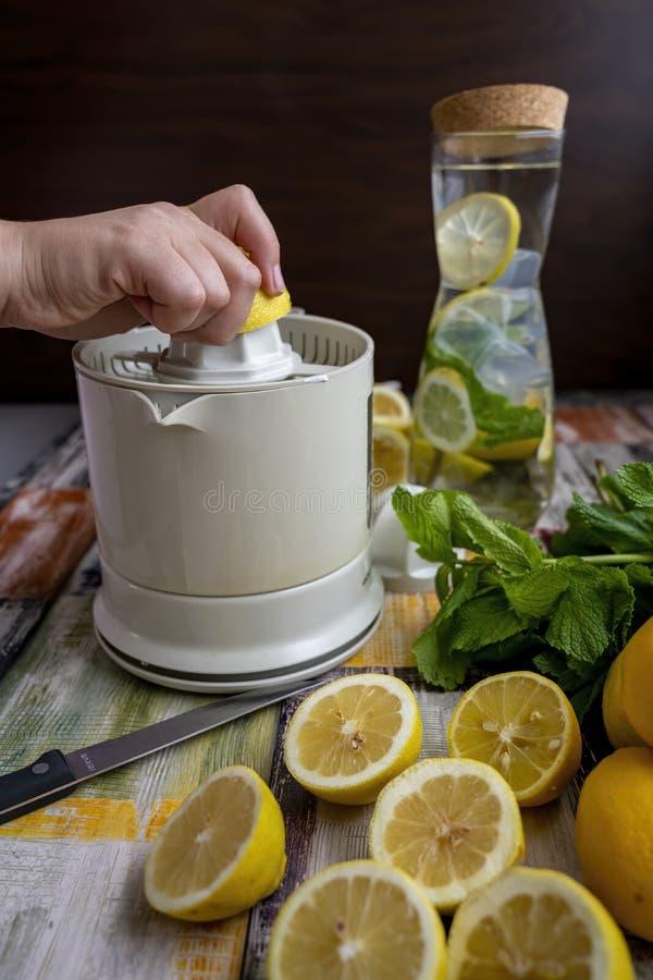 Preparation of Fresh Juices Press on Fresh Lemon and Lime. Lemon ...