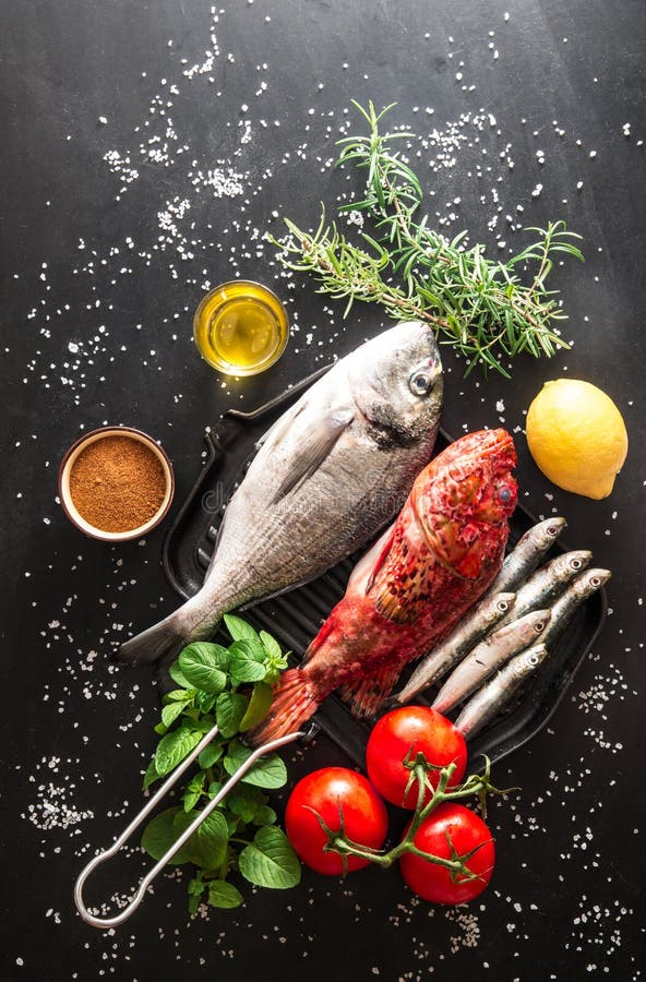 Preparation of a Grilled Fish Stock Photo - Image of tomato, bream ...