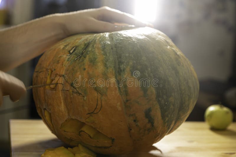 Preparation for the Holiday. the Process of Carving a Halloween Pumpkin ...