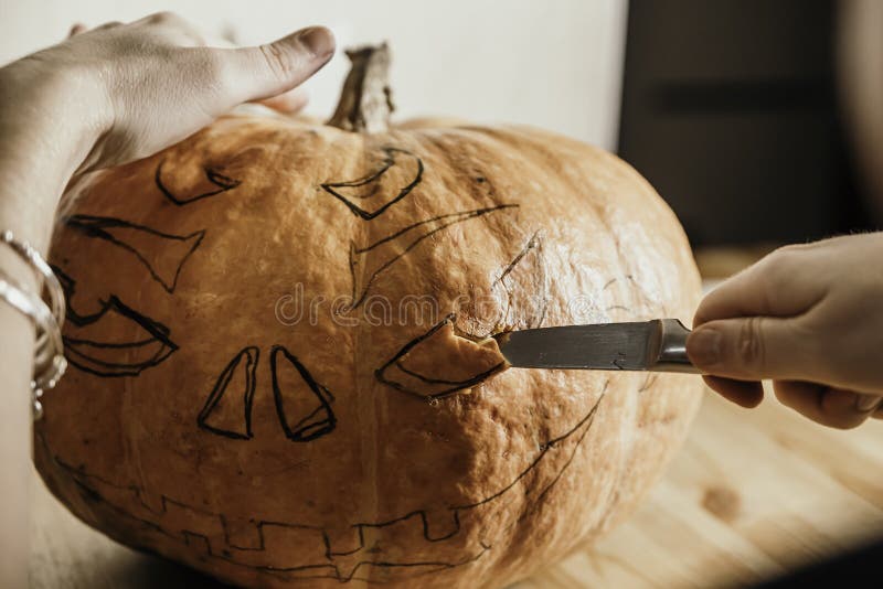 Preparation for the Holiday. the Process of Carving a Halloween Pumpkin ...