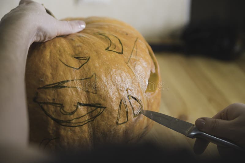 Preparation for the Holiday. the Process of Carving a Halloween Pumpkin ...