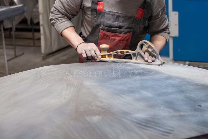 Preparation for Painting a Car Element Using Emery Sender by a Service ...