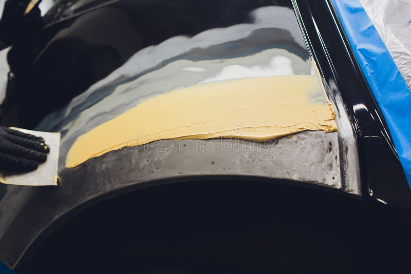 Preparation for Painting a Car Element Using Emery Sender by a Service ...