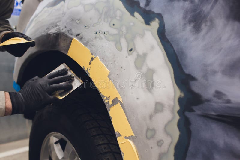 Preparation for Painting a Car Element Using Emery Sender by a Service ...