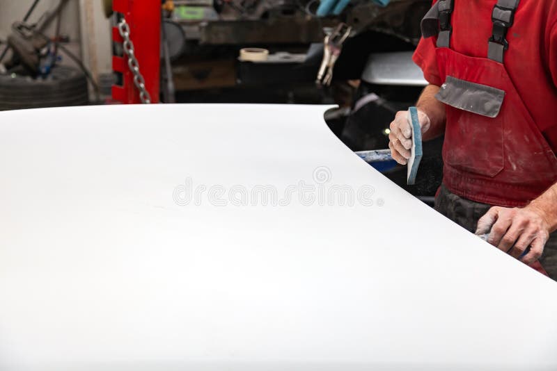 Preparation for Painting a Car Element Using Emery Sponge by a Service ...