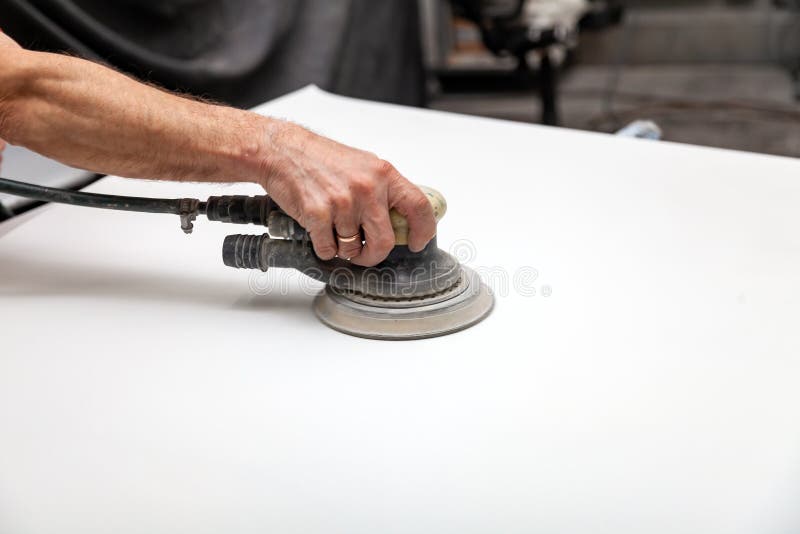 Preparation for Painting a Car Element Using Sander and Putty by a ...