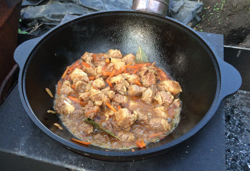 Preparation of Pilaf in Kazan Stock Photo - Image of preparation, bread ...