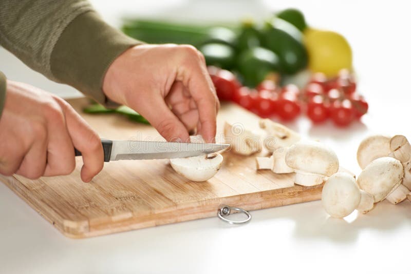 Preparation with Precision. a Man Cooking in His Kitchen. Stock Image ...
